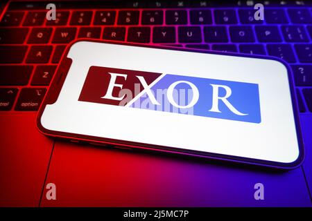 In this photo illustration, an Exor Group logo seen displayed on a ...