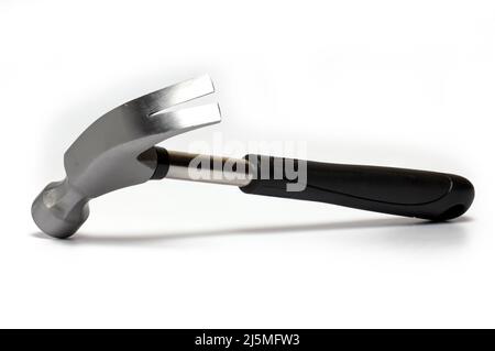 Hammer with black rubber handle with nails on white isolated background ...