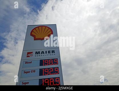 Logos of the oil and gas company Royal Dutch Shell on a heap on a table ...