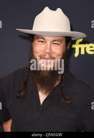 Stephen A. Chang walking on the red carpet at the Los Angeles premiere ...