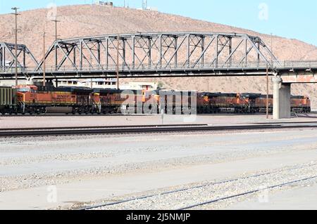 BNSF 7780 BNSF Railway GE ES44DC locomotive passing through Barstow station with a freight train ...