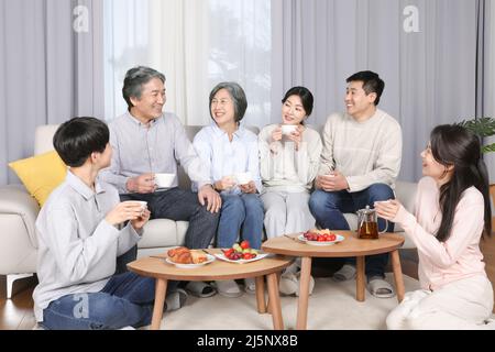 Asian Korean family enjoying tea time Stock Photo - Alamy