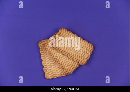 Three rectangular cookies against a blue background. Ready-to-eat ...