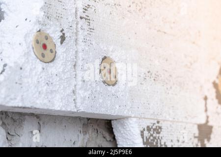 Polystyrene foam glued to an aerated concrete block wall Stock Photo ...