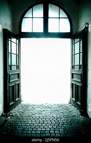 Open door with bright light outside Stock Photo - Alamy