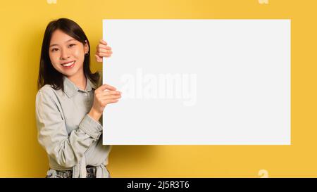 Flyer with portrait of charming young woman with light makeup holding ...