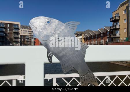 Shiny, metal fish sculptures on a bridge at Roath Basin, Cardiff Bay ...