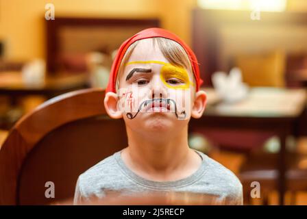 Portrait of unhappy child with face mask for covid-19 coronavirus ...