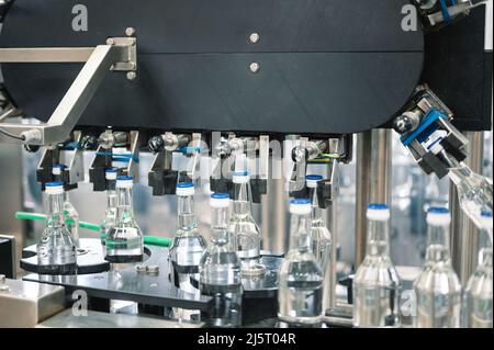 visual inspection of bottles with vodka Stock Photo - Alamy
