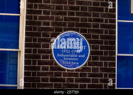 Blue plaque marking the high water mark reached by flood waters during ...