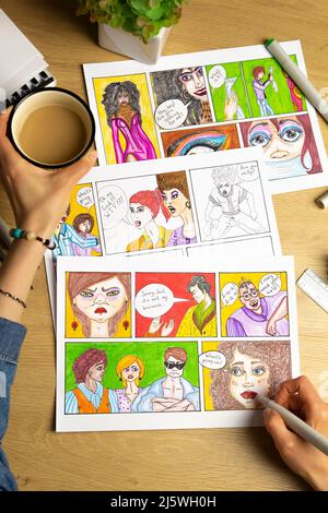 The artist designer draws sketches of comic book characters on paper ...