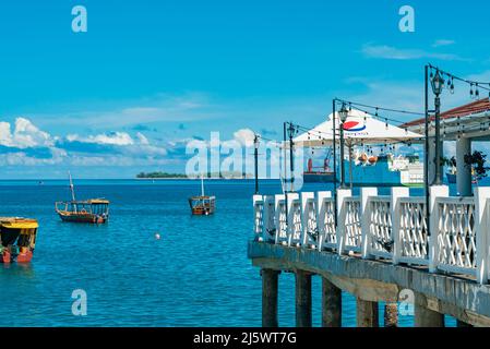 STONE TOWN, ZANZIBAR - DECEMBER 22, 2021: Boats in a port of Stone Town ...