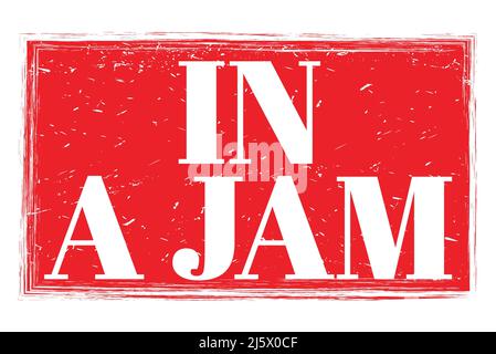 IN A JAM, words written on red stamp sign Stock Photo - Alamy