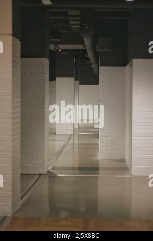 Unusual and interesting interior room with brick columns and a winding ...