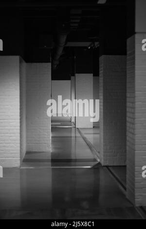 Unusual and interesting interior room with brick columns and a winding ...