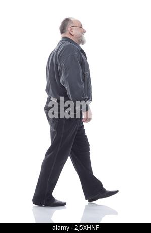 Happy older man walking forward in farm. Senior person portrait face at ...