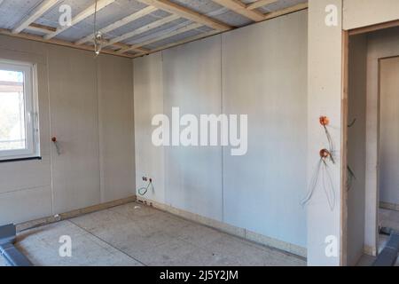 Construction of new home interior drywall installation and finish ...