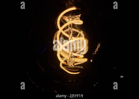 long tube-shaped Edison lamp, bulb, black background Stock Photo - Alamy