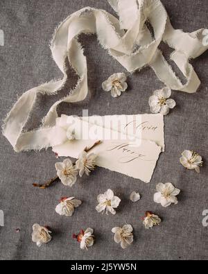 Spring Grey Background with flowers and ribbons on a gray background ...