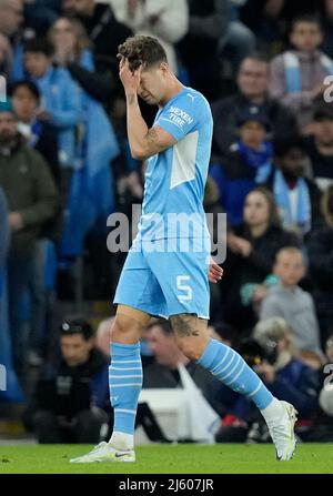 John Stones of Manchester City leaves the field of play to a standing ...