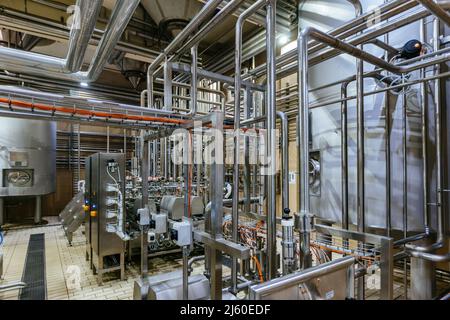 Industrial steel vats connected by the pipeline Stock Photo - Alamy