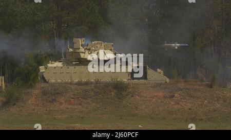 A Bradley Infantry Fighting Vehicle fires a TOW anti-tank guided ...