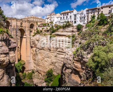 View of the medieval Puente Nuevo (New Bridge) spanning a gorge in the ...