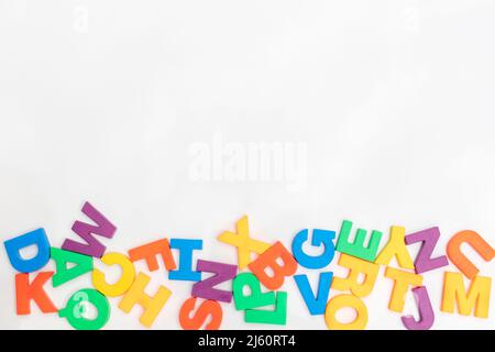 Alphabets background on a white blank board background Stock Photo - Alamy