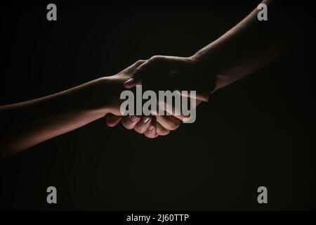 Handshake hand, arm on salvation. Close up help hand. Two hands ...