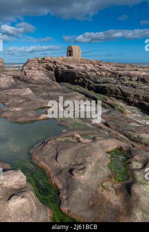 The old powder house on Seahouses beach Northumberland England UK Stock ...