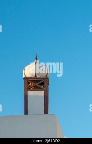 Beautiful chimneys are typical for traditional houses of Lanzarote, one ...