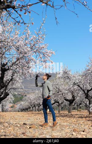 portrait of man gardener smelling flowers Stock Photo - Alamy