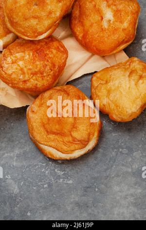 South African vetkoek, deep fried savory dough filled with saucy savory ...