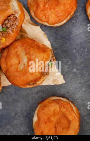 Traditional South African Vetkoek and mince Stock Photo - Alamy