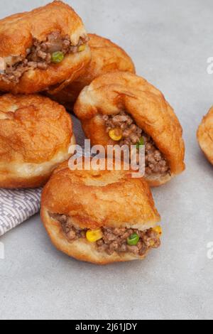 Traditional South African Vetkoek and mince Stock Photo - Alamy