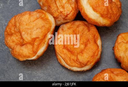 South African vetkoek, deep fried savory dough filled with saucy savory ...