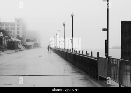 Waterfront pier in very heavy fog on the shoreline Stock Photo - Alamy