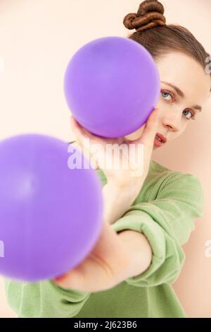 Beautiful woman on purple background. Studio shot of pretty cheerful ...