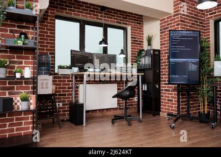 Empty office with multiple monitors showing hacking attack alert, IT agency dealing with ...