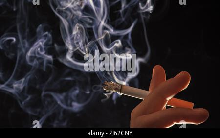 Smoke and choke. Cigarette smoke dark background. Steaming cigarette in ...
