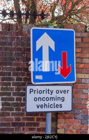 Priority over oncoming vehicles UK road traffic sign with white and red ...