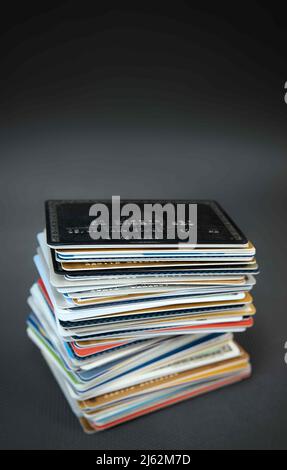 credit cards stack on dark color wooden table Stock Photo - Alamy