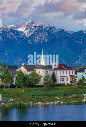 Vertical Puffy clouds at sunset Vehicles parked on the asphalt road ...