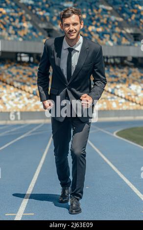 Full length photo of young focused happy woman look empty space play ...
