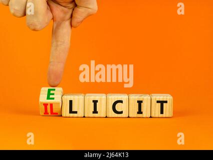 Illicit or elicit symbol. Businessman turns wooden cubes and changes ...