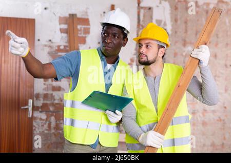 Engineer indicate anything to work on construction site Stock Photo - Alamy