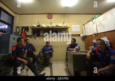Firefighters having a relax time at their station in Petojo, Central ...