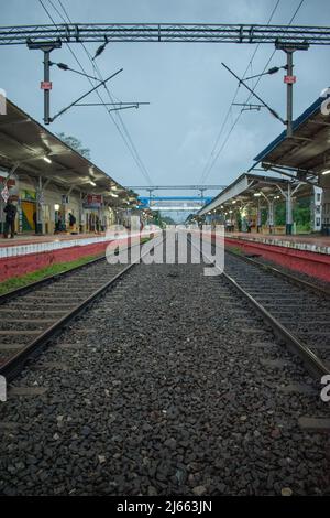 railway tracks between two platforms of the Railway station Stock Photo ...