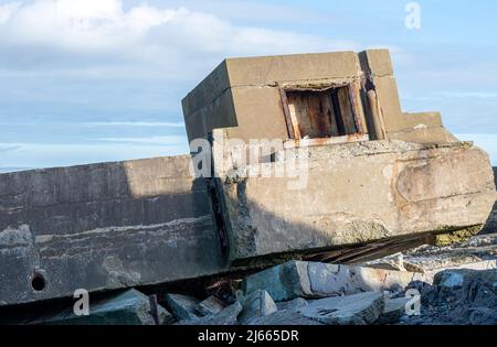 Wrecked coastal fortifications on the beach at Easington near Spurn ...