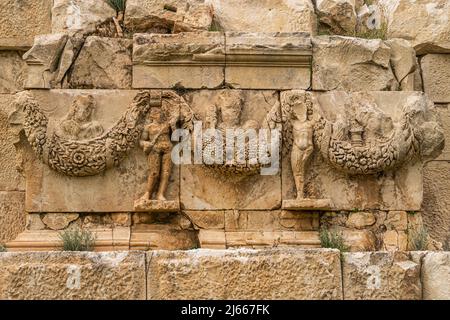 Preserved bas-reliefs with floral ornaments and faces. Demre, Antalya ...